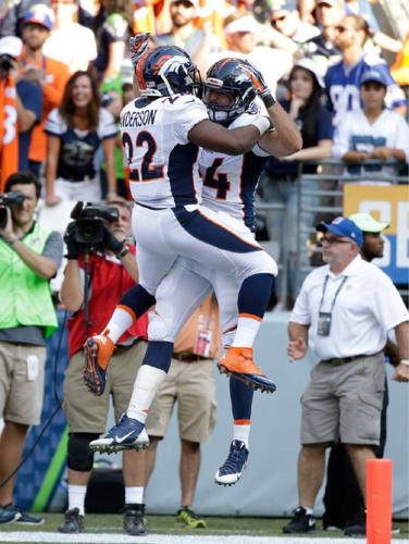 Russell Wilson, Marshawn Lynch help Seattle hold off Broncos 26-20 in ...