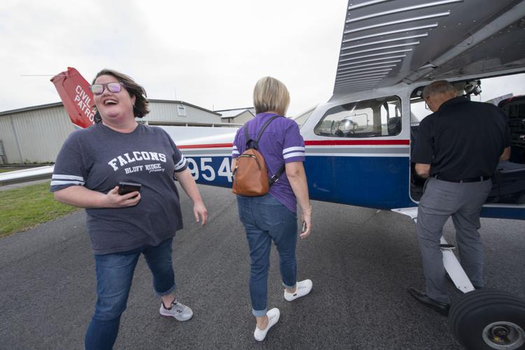 2 STEM teachers fly over schools as cheering students wave from below ...