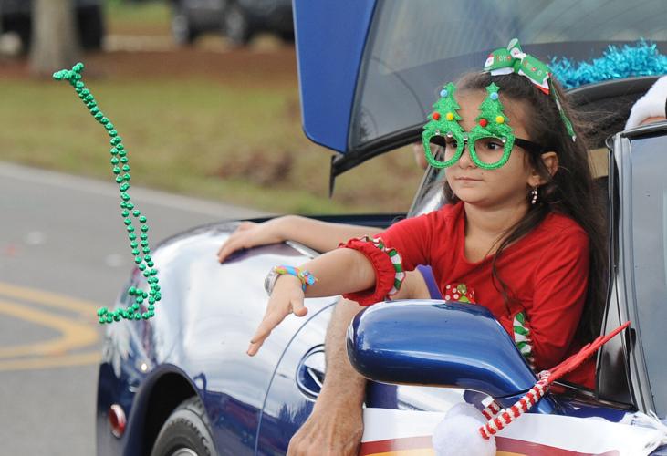 Dark clouds, rain can't stop Walker Christmas parade from rolling ...