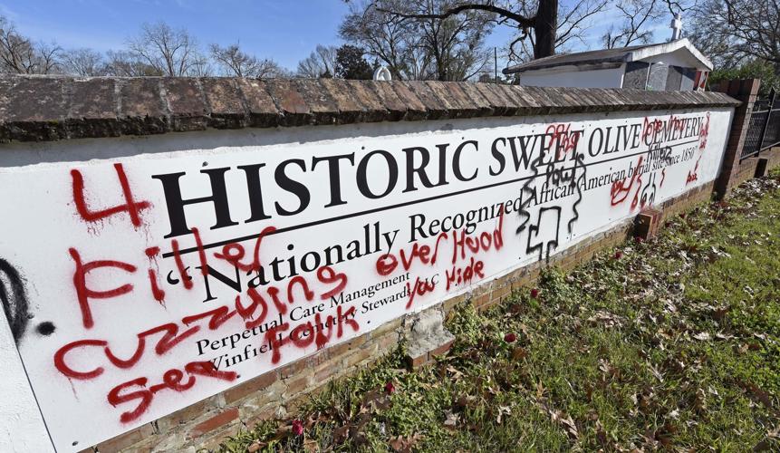 Graffiti covers sign at Baton Rouge's oldest African American cemetery ...