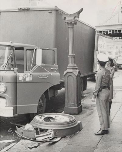 Why does a clock stand in front of the Roumain Building? | Curious ...