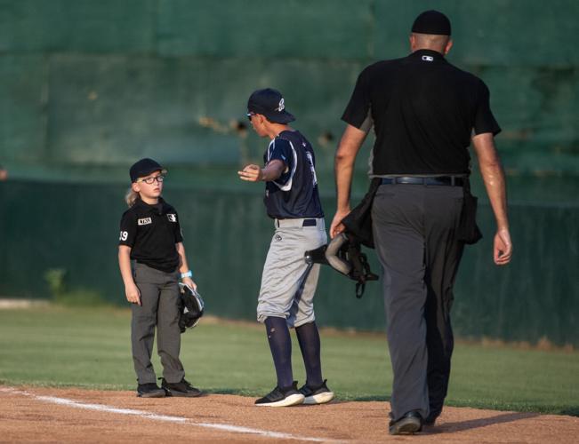 A 9-year-old Louisiana baseball umpire is a hit. See the photos of him ...
