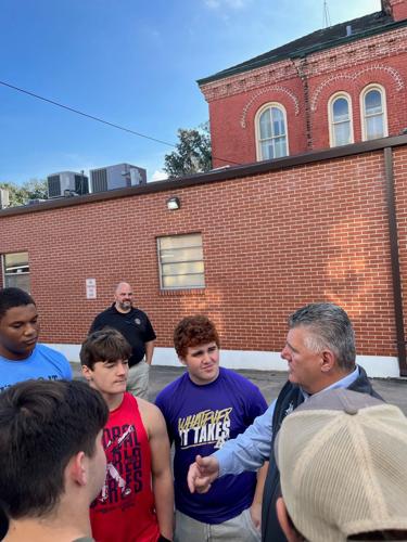 Ascension Catholic football players help fill Christmas lists of ...
