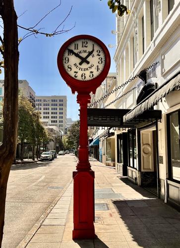 Why does a clock stand in front of the Roumain Building? | Curious ...