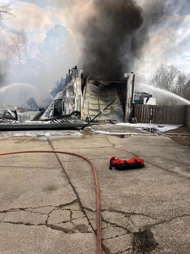 Civilians help rescue firefighter after overhang roof collapses ...