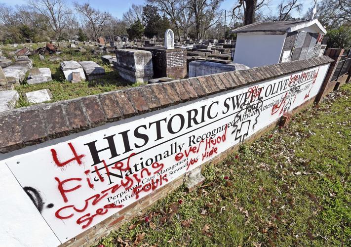 Graffiti covers sign at Baton Rouge's oldest African American cemetery ...