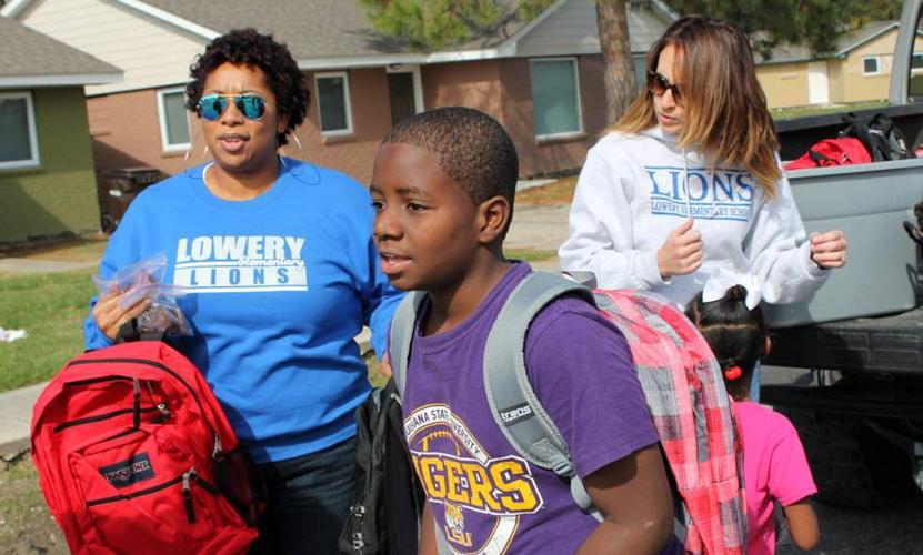 Lowery staff surprises elementary students with backpacks, holiday ...