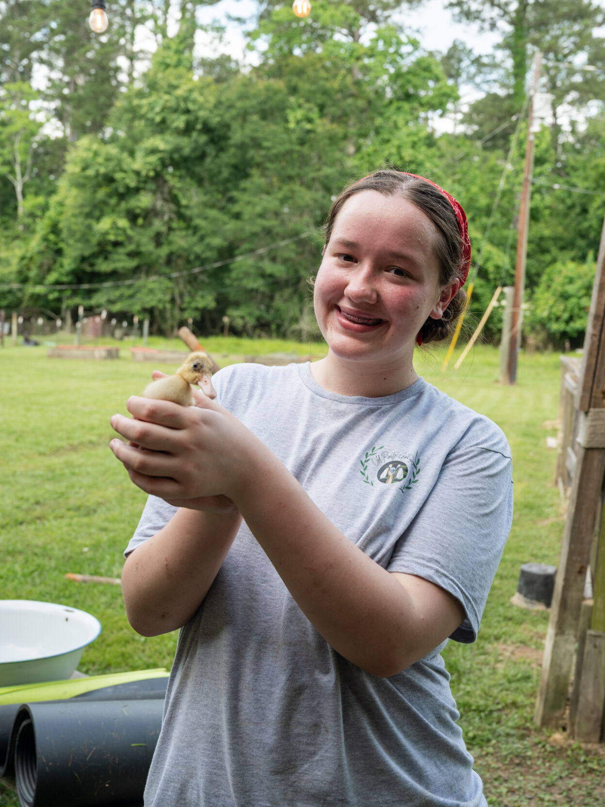 Rose Allen, daughter of Sarah Allen and helper at the farm, hold ...