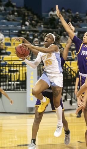 Different colored shoes working well for Southern guard Genovea Johnson ...