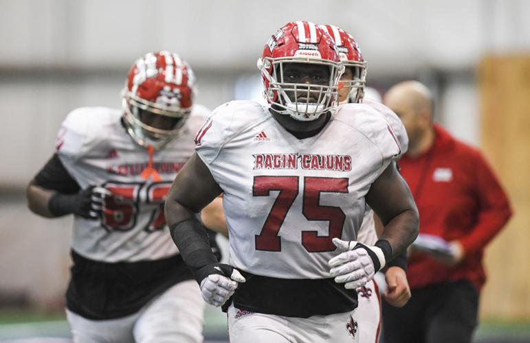 A draft and a dream: Kevin Dotson, Malcolm Roach eager to see their NFL ...