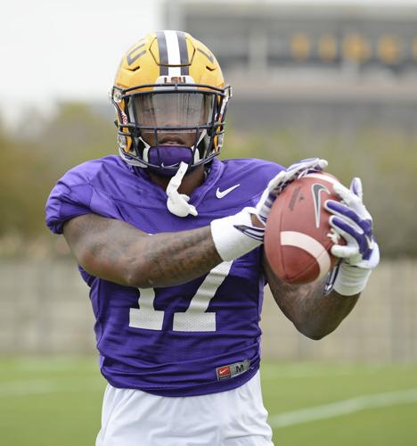 X in the box: LSU's Xavier Lewis back near line of scrimmage, leads ...