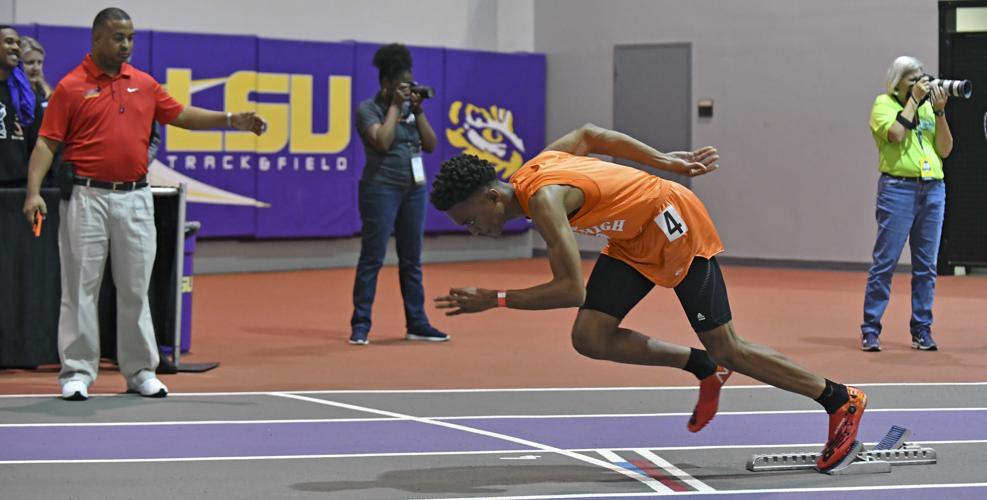Soaring and scoring: Zachary's Chris Hilton clears 7-0 in high jump ...