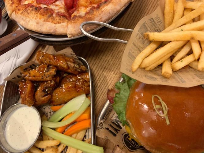 Review: At Main Event, food doesn't take center stage. But it ...