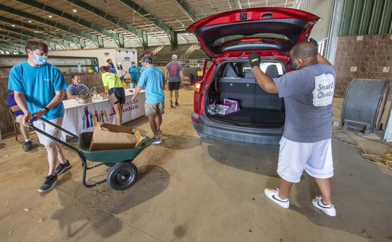 Ascension residents drive thru rodeo arena to donate to Hurricane Laura ...