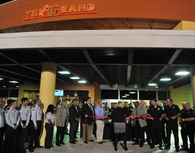 Nov. 19: Crowd gathers to celebrate the reopening of The Grand 16 Theatre, closed since July 23 ...