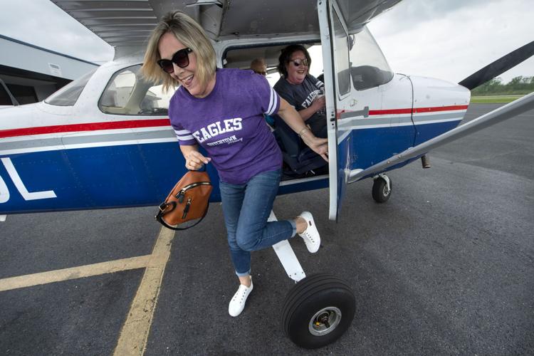 2 STEM teachers fly over schools as cheering students wave from below ...