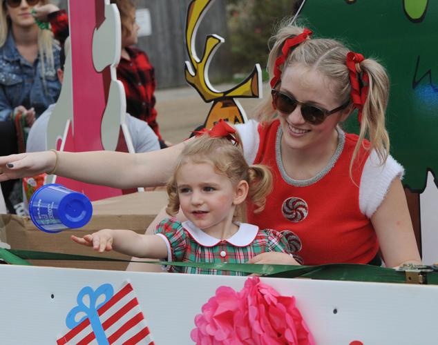 Dark clouds, rain can't stop Walker Christmas parade from rolling ...