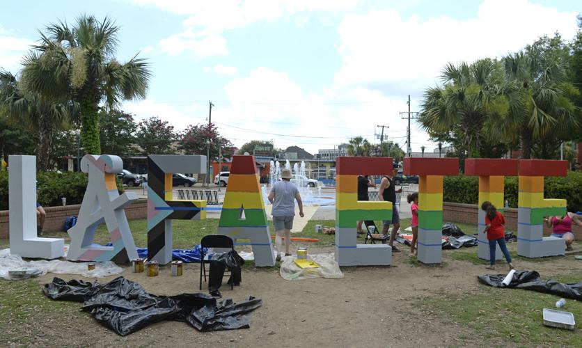 Downtown Lafayette sign gets a fresh coat of rainbow paint for Pride ...