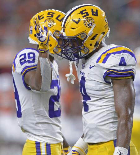 LSU's K'Lavon Chaisson, Adrian Magee leave Miami game injured; Orgeron ...