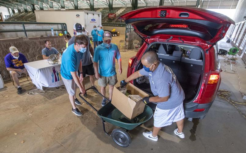 Ascension residents drive thru rodeo arena to donate to Hurricane Laura ...