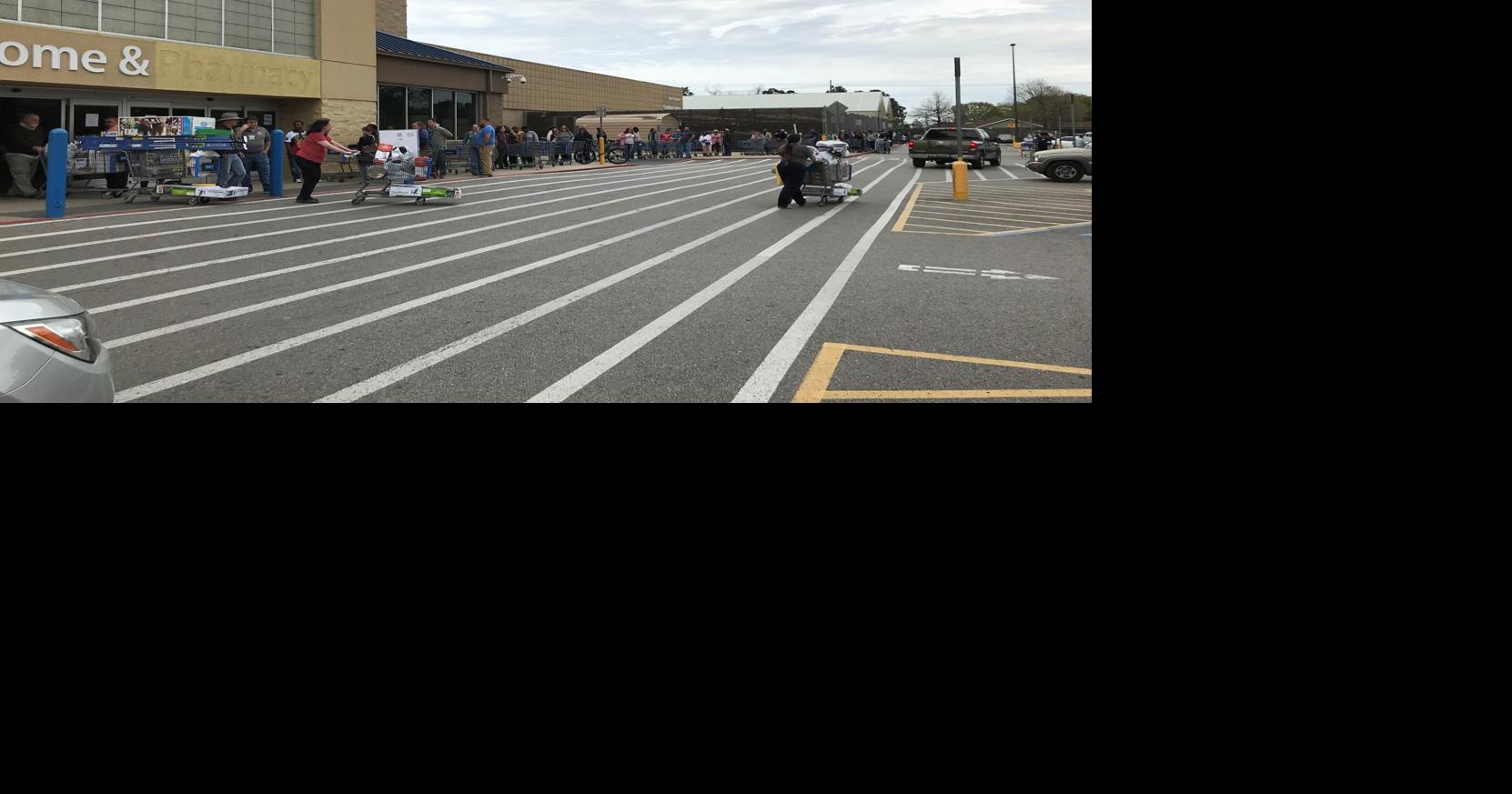 Shoppers line up around the building at Lafayette Walmart looking for ...