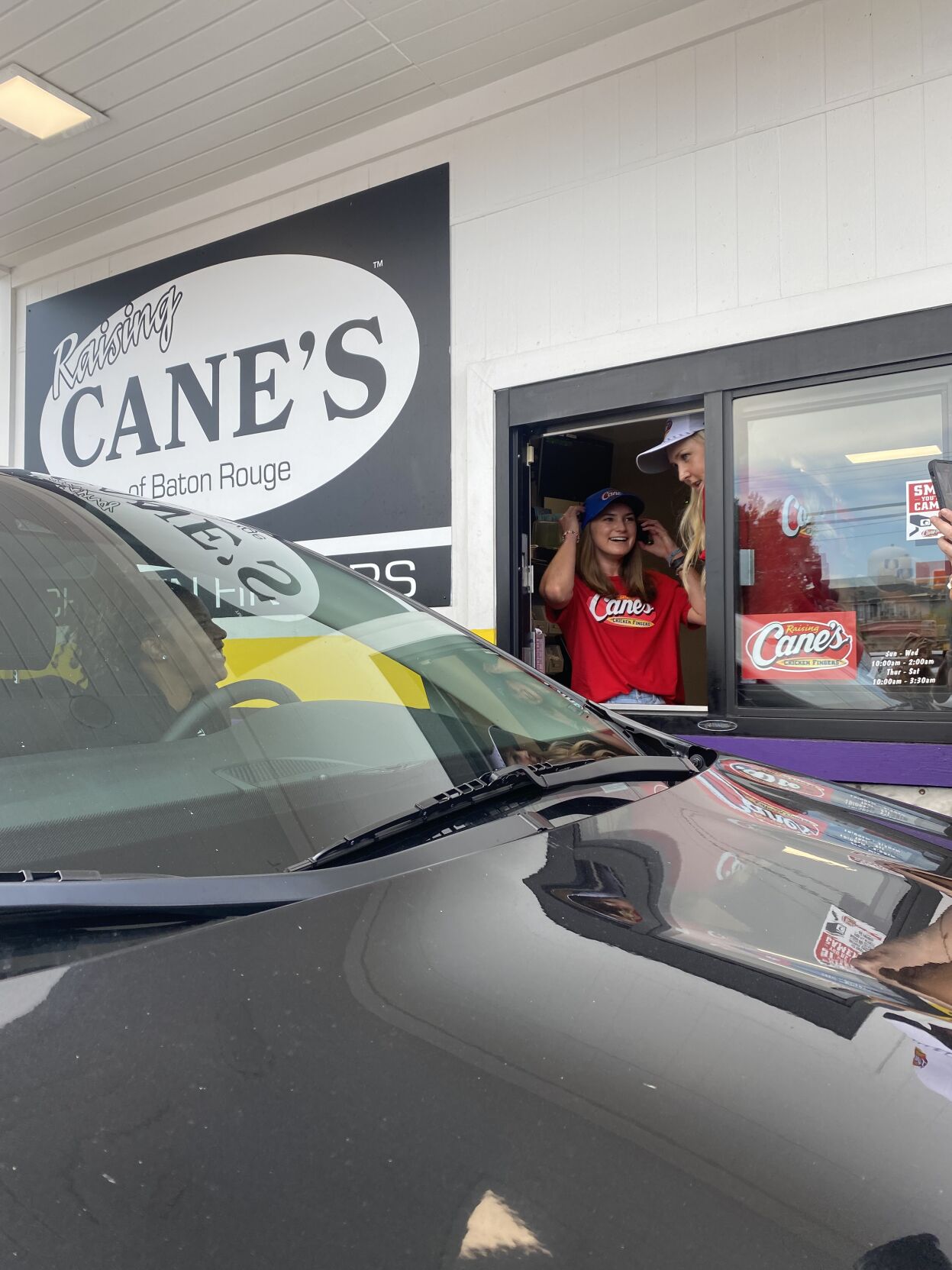Louisiana Olympic duo works a shift at Cane's in Baton Rouge | News ...