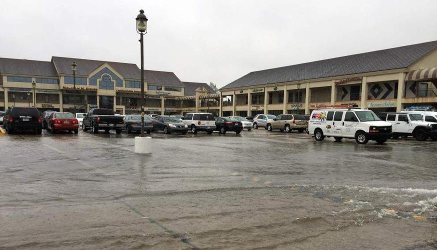 Flooded streets and floating garbage cans: Photos of Friday's soggy ...