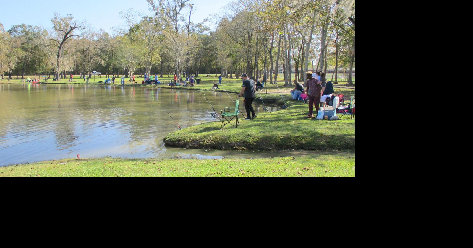 Anglers line pond at Sidney Hutchinson Park for annual fishing rodeo ...