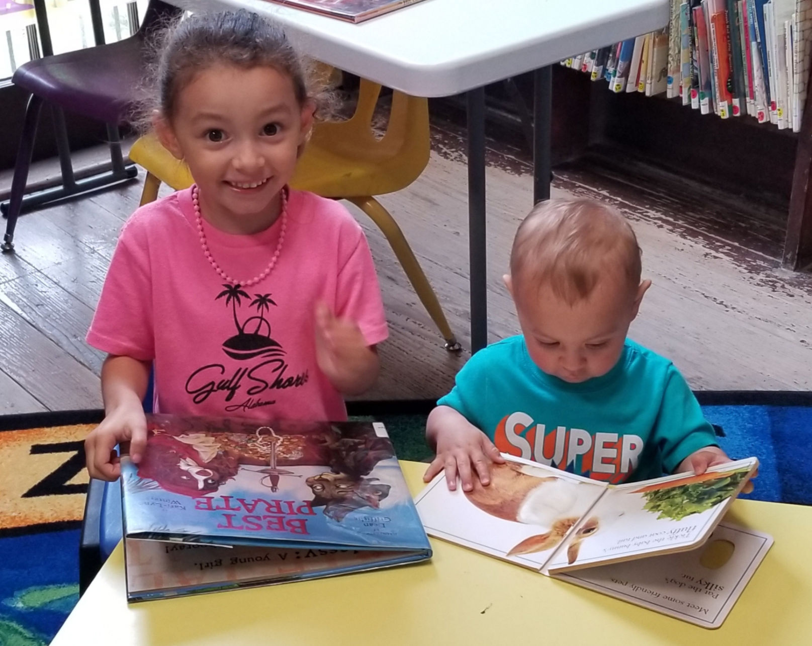 Children Visit Library With Grandmother 