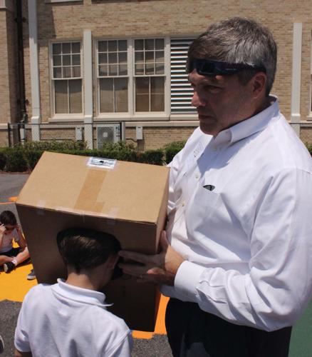 Sacred Heart students raise their shaded eyes to the skies for solar ...