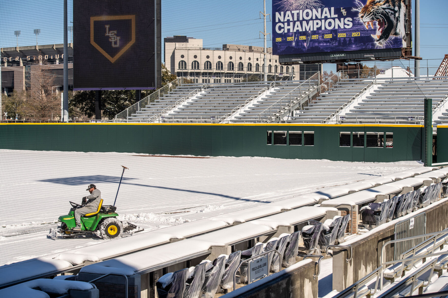 LSU grounds crew clear snow from field at Alex Box Stadium | Photos ...