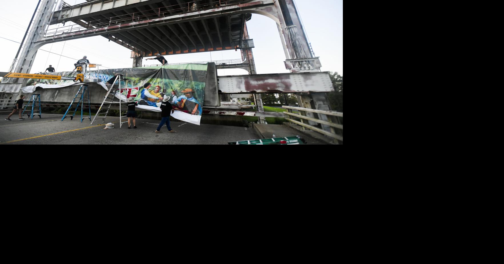 Photos: Artist Robert Dafford's murals installed on Pinhook bridge ...