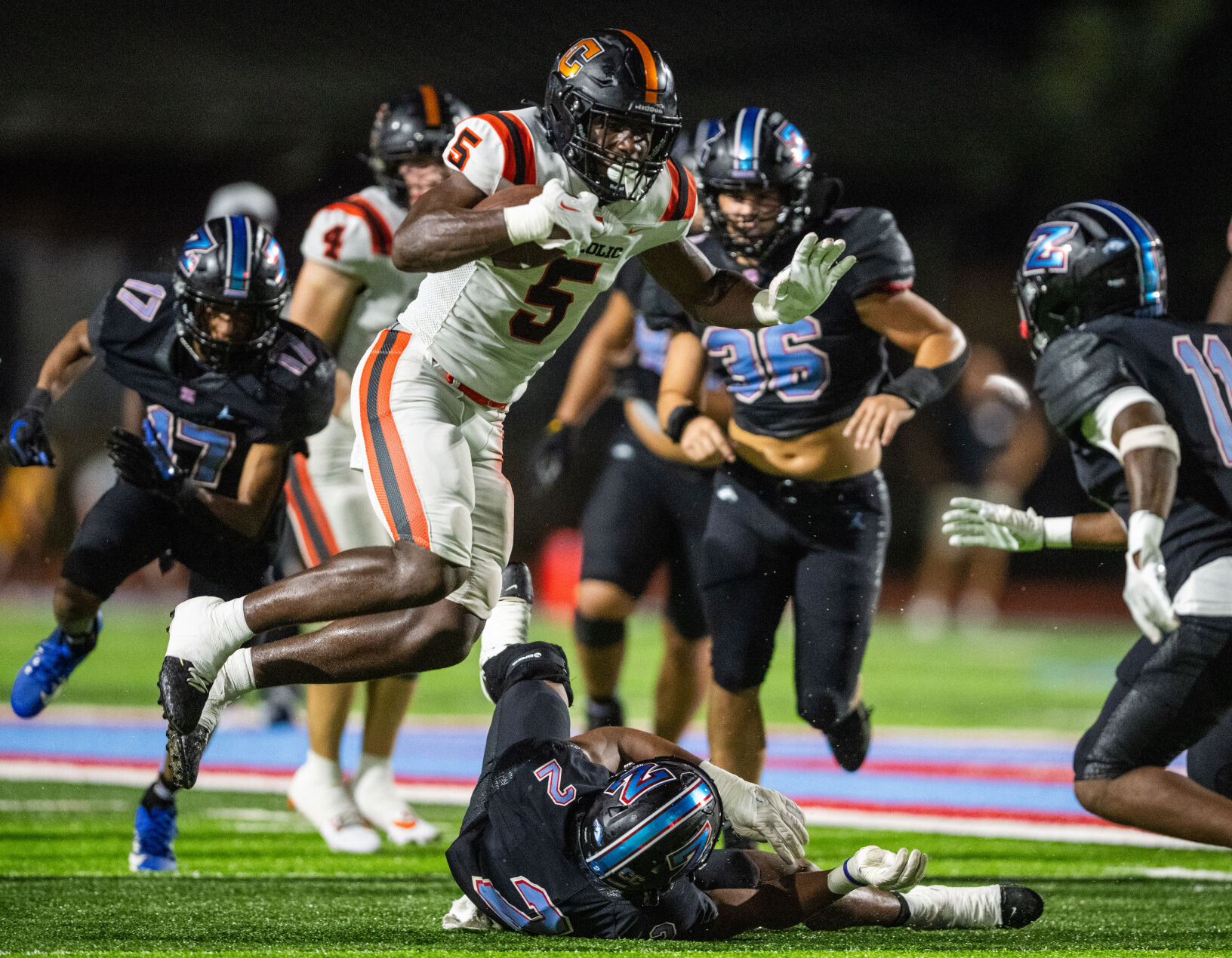 Photos: Record breaking night by Jayden Miles leads Catholic to ...