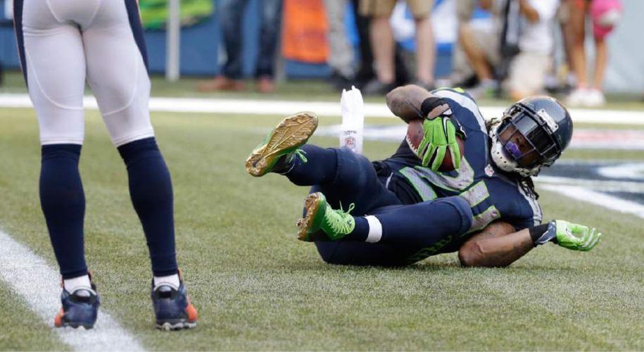 Russell Wilson, Marshawn Lynch help Seattle hold off Broncos 26-20 in ...