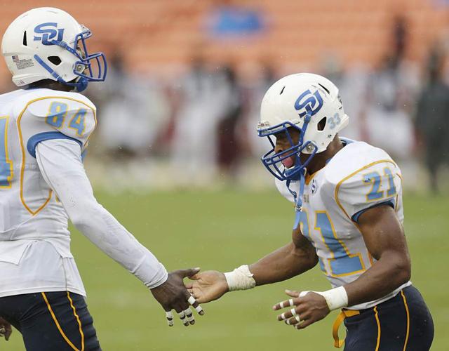 Photos: Southern sloshes its way to messy, but important, win at Texas ...