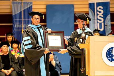 Chairman Sarris awarded the degree by Acting President of SSU Dr ...