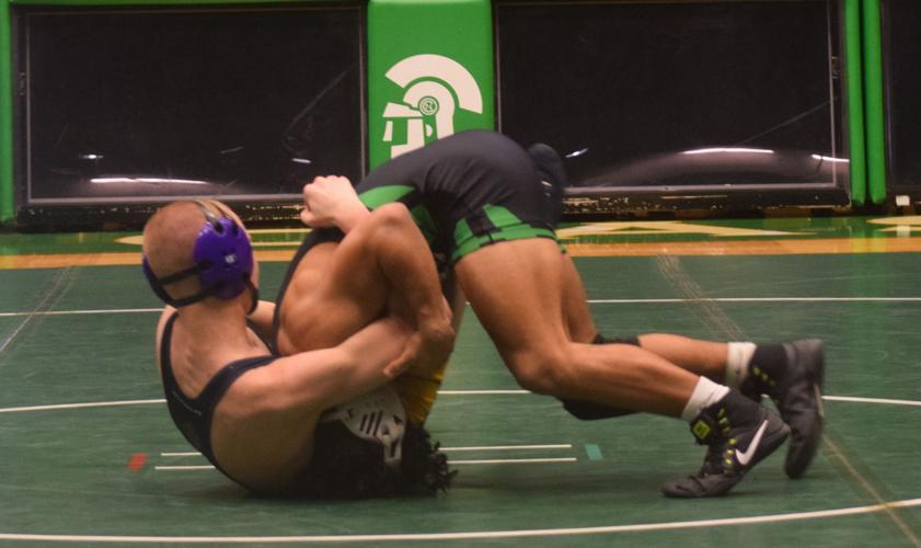 Trojan wrestlers overwhelm Raiders on Senior Night | Sports ...