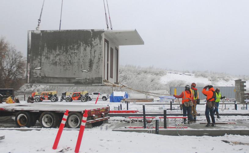 Some assembly required: Officials watch as first cell is installed at ...