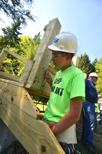 Building a bridge, bonds Students construct bridge over Wetland Berm ...