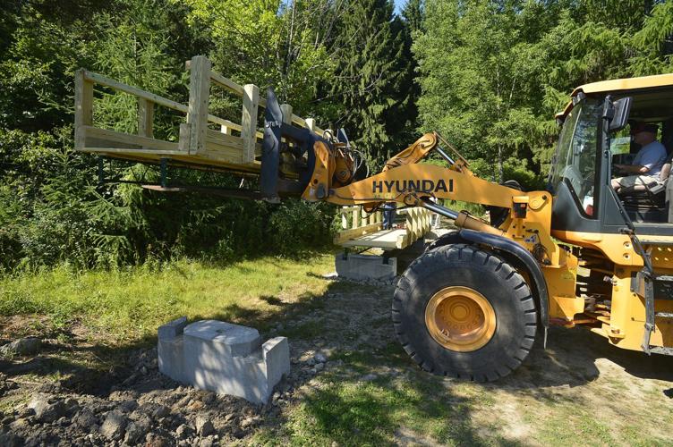 Building a bridge, bonds Students construct bridge over Wetland Berm ...