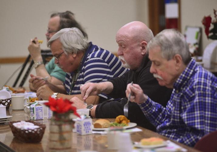 Seniors share Christmas traditions over Senior Center dinner ...