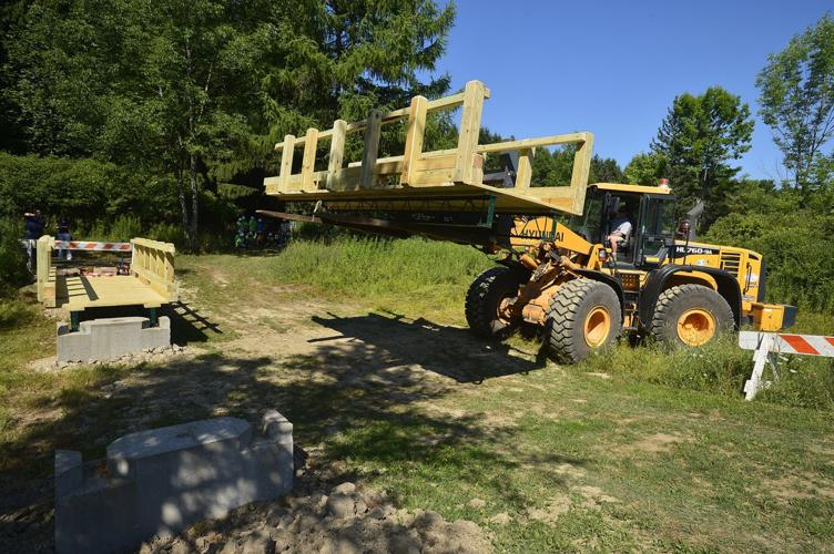 Building a bridge, bonds Students construct bridge over Wetland Berm ...
