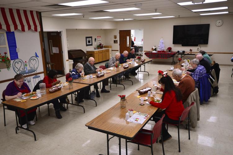 Seniors share Christmas traditions over Senior Center dinner ...