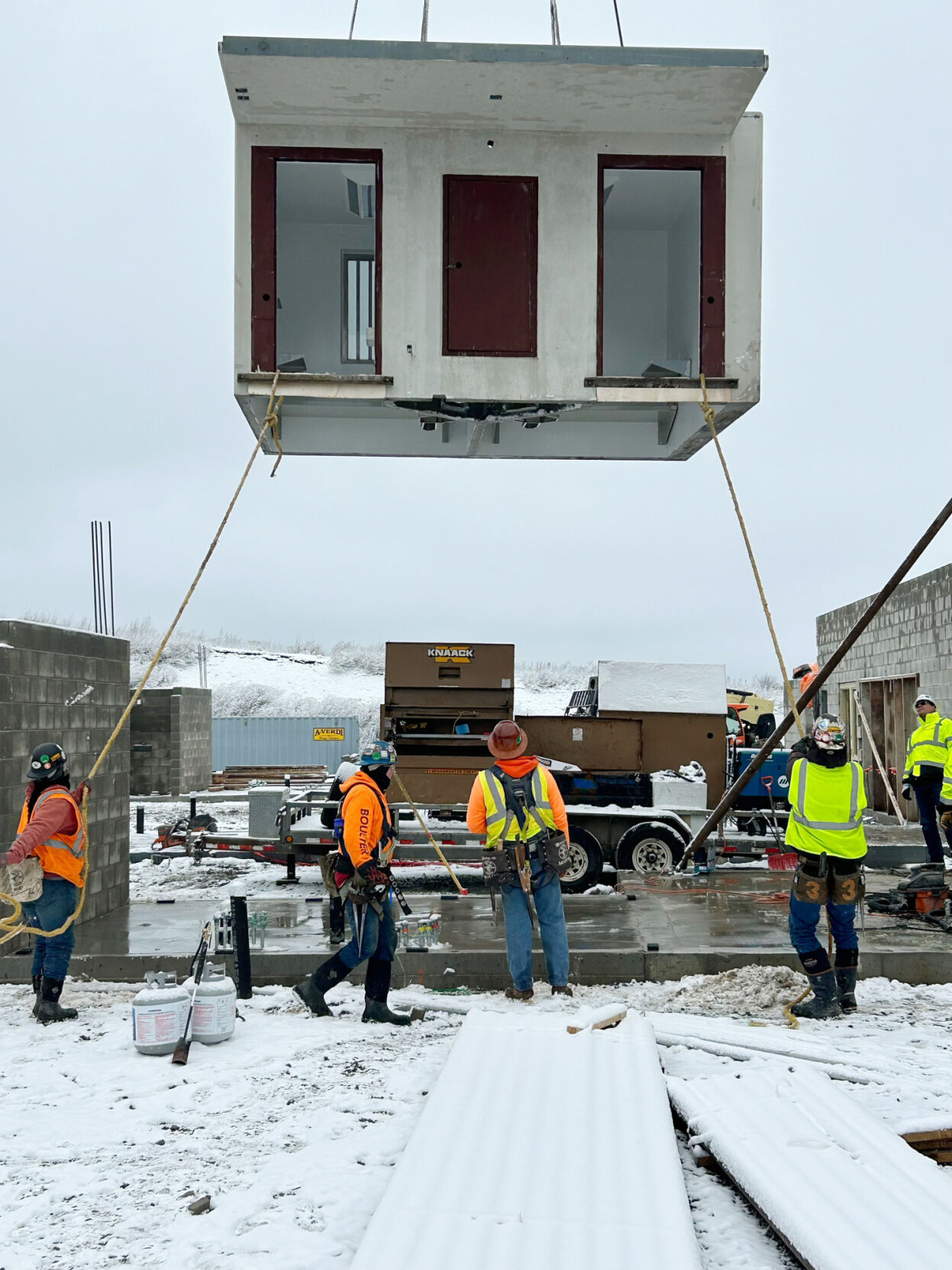 Some assembly required: Officials watch as first cell is installed at ...