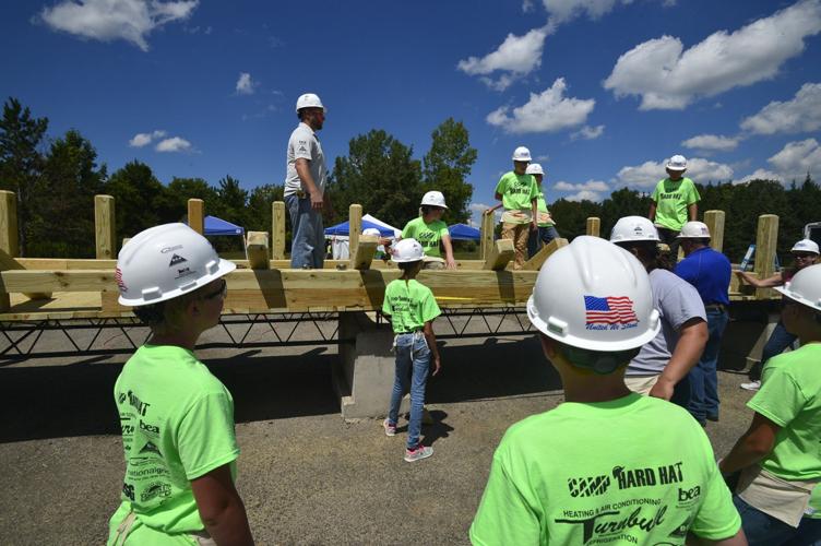 Building a bridge, bonds Students construct bridge over Wetland Berm ...