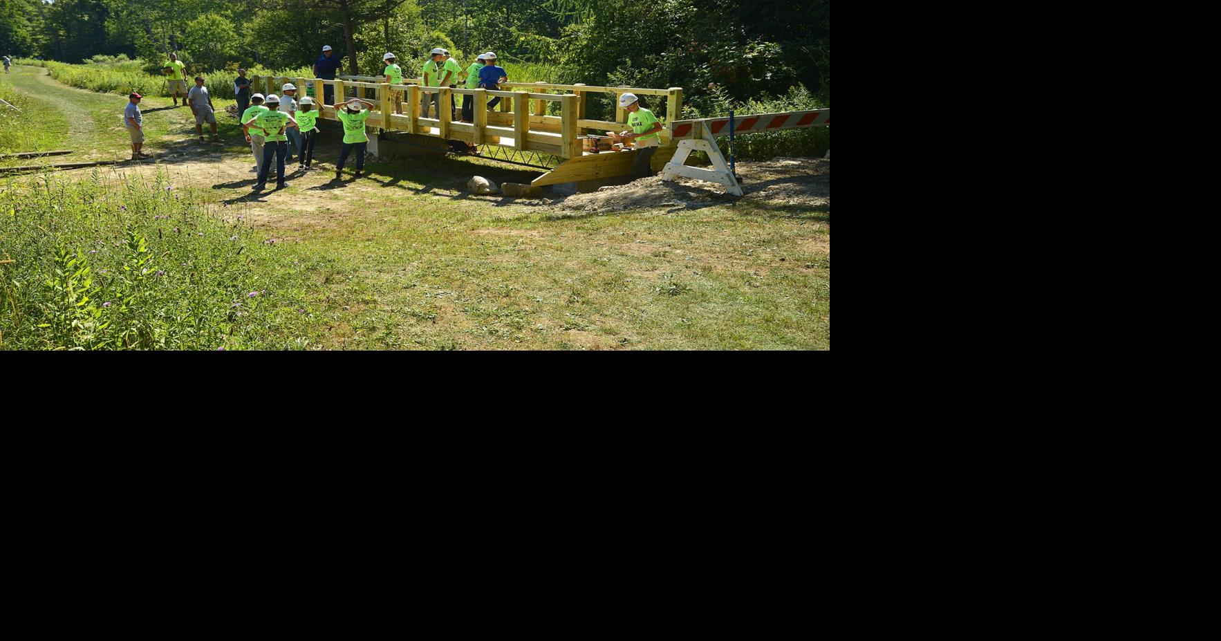 Building a bridge, bonds Students construct bridge over Wetland Berm ...