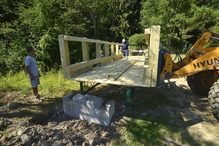 Building a bridge, bonds Students construct bridge over Wetland Berm ...