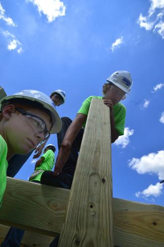 Building a bridge, bonds Students construct bridge over Wetland Berm ...