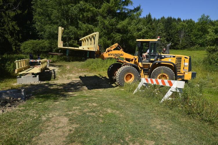 Building a bridge, bonds Students construct bridge over Wetland Berm ...