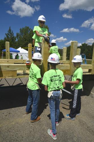 Building a bridge, bonds Students construct bridge over Wetland Berm ...